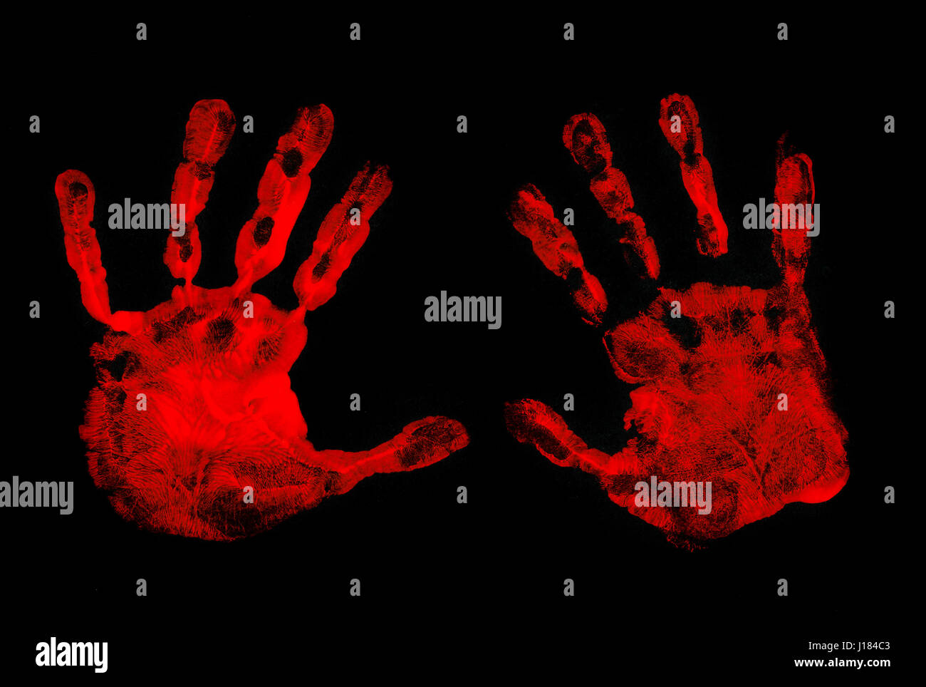 Set of red hand prints on black background Stock Photo - Alamy