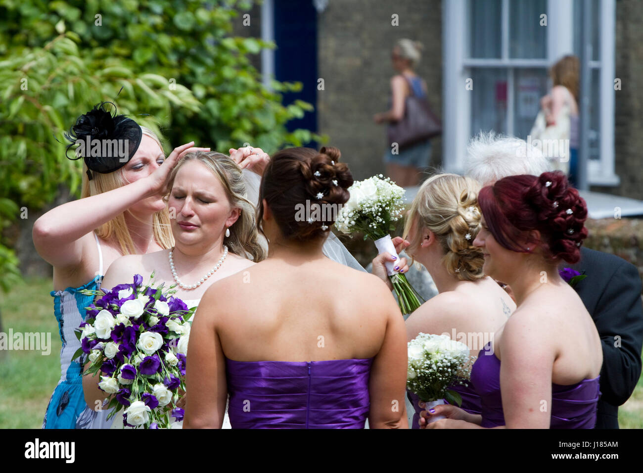 Bride have her hair adjusted before the ceremony Stock Photo - Alamy