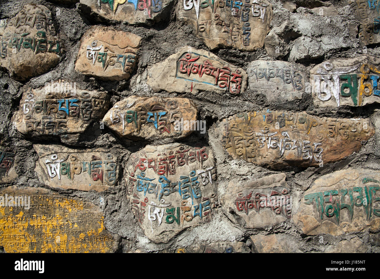 Writing carved on a stone wall Swayambhu / Swayambhunath, Kathmandu ...
