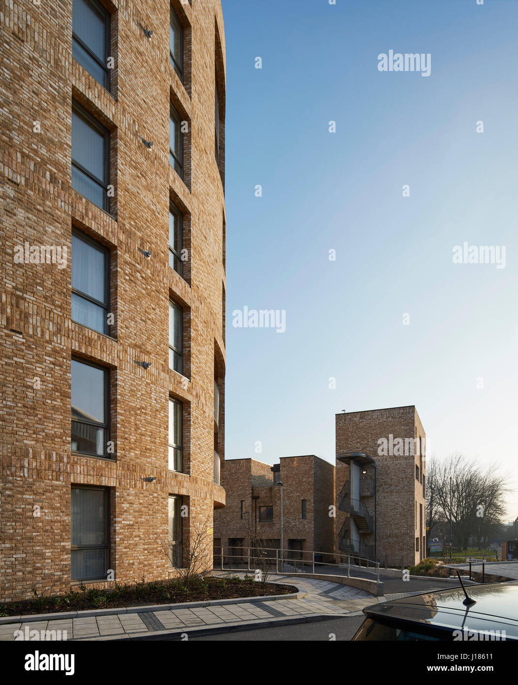 Curved exterior brick facade of rotunda tower. Stonebridge Park, London ...