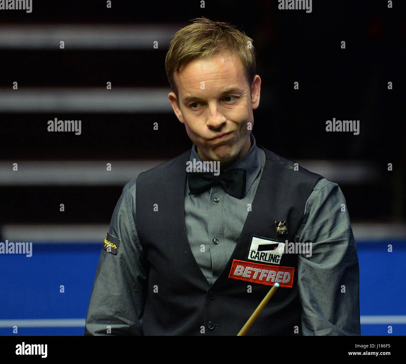 Ali Carter studies the table in his match against Graeme Dott on day ...