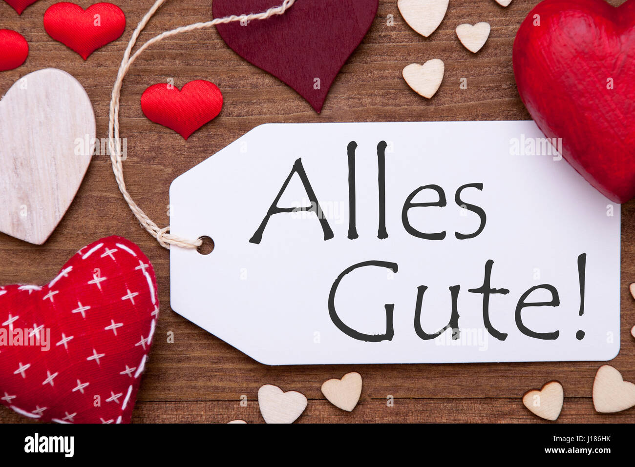 Label With German Text Alles Gute Means Best Wishes. Red Textile Hearts ...