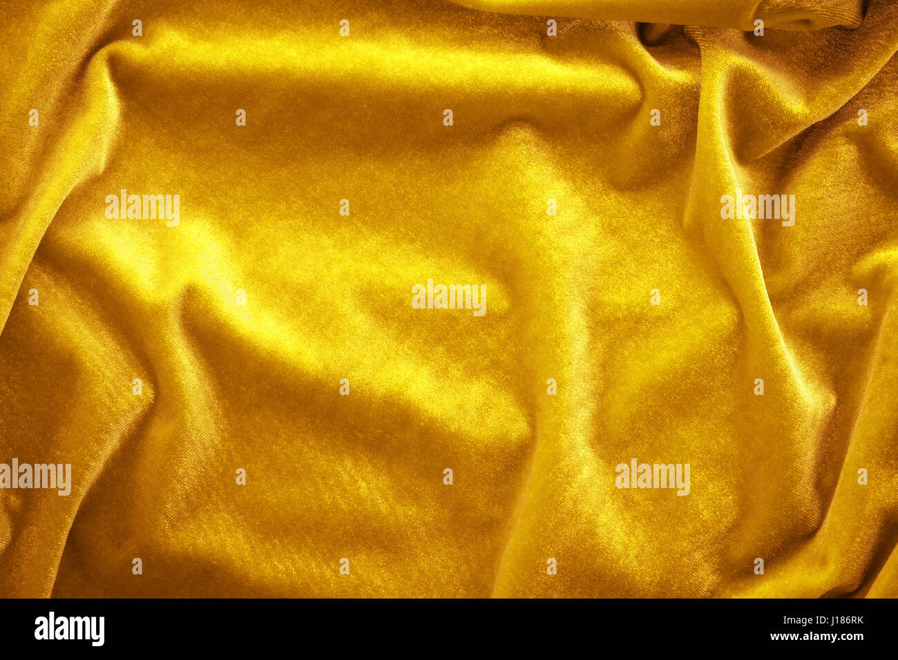 Golden silk velvet close up. Texture and background Stock Photo - Alamy