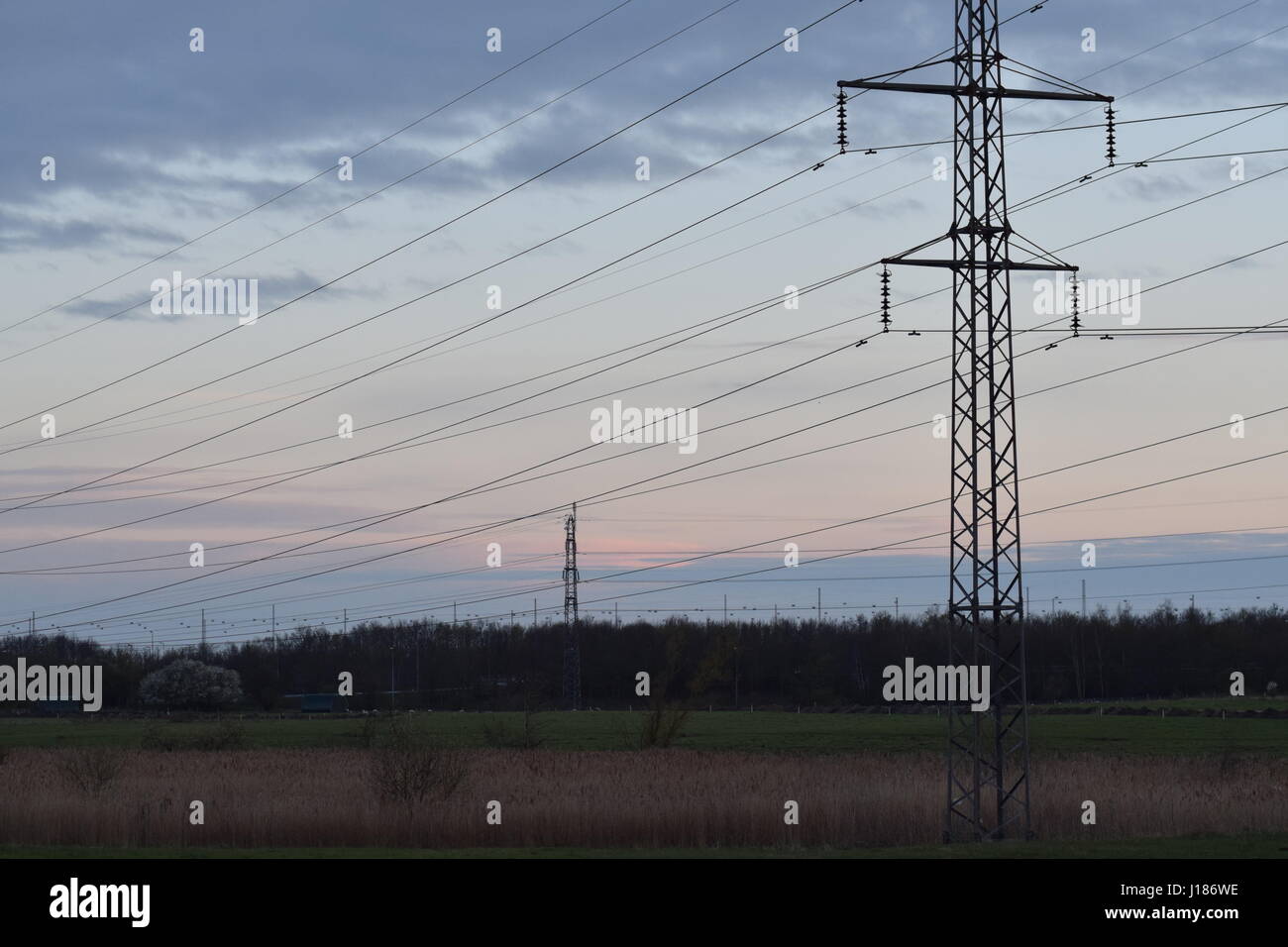 High voltage power lines transmission tower hi-res stock photography ...