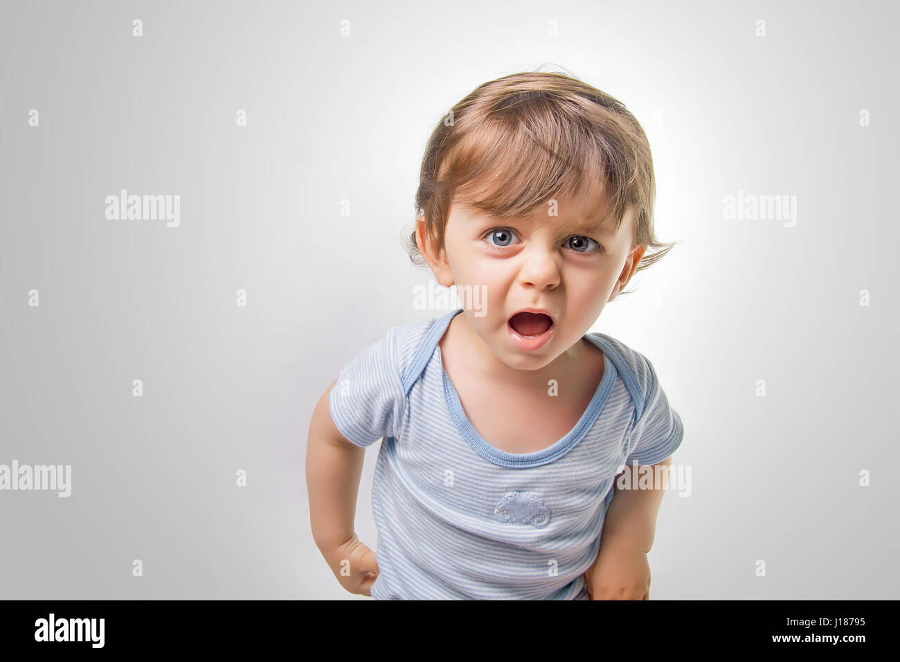 Baby shouting at the camera Stock Photo - Alamy