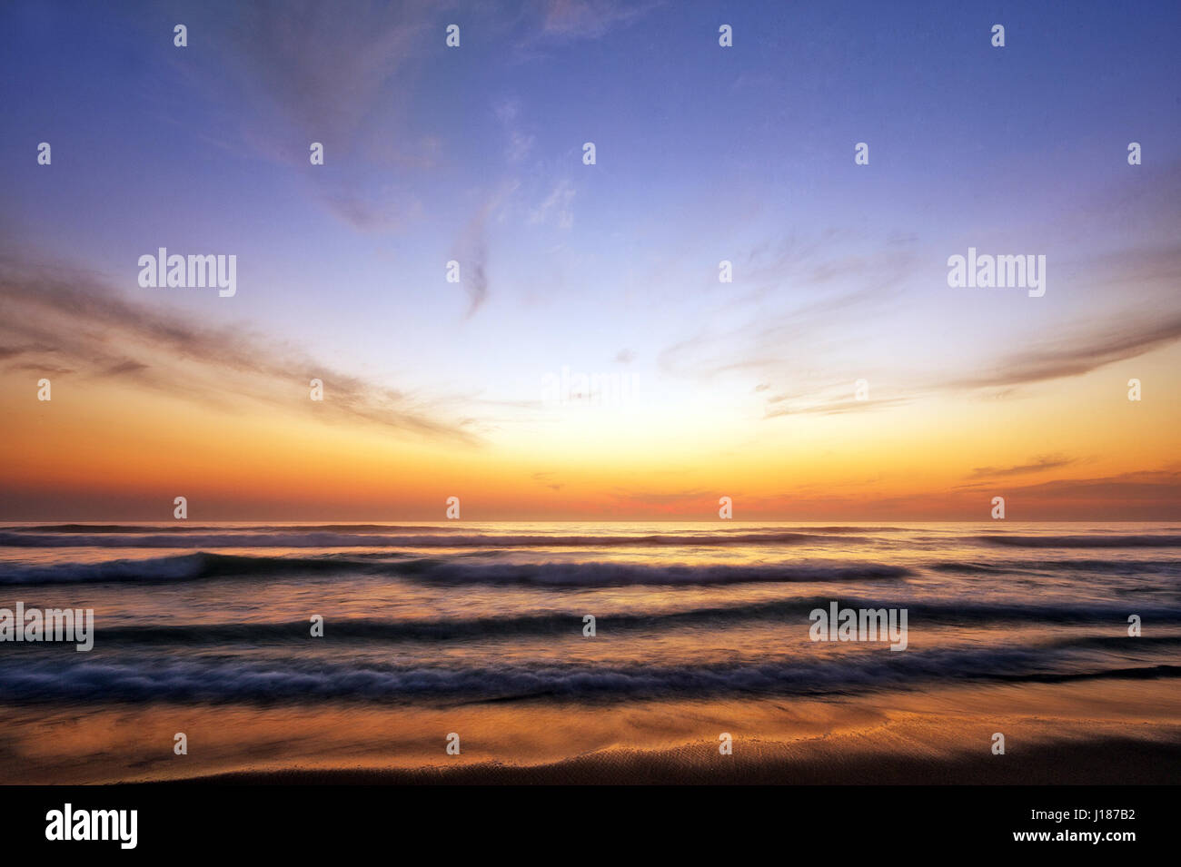 Beautiful late afternoon sunset at the beach Stock Photo - Alamy