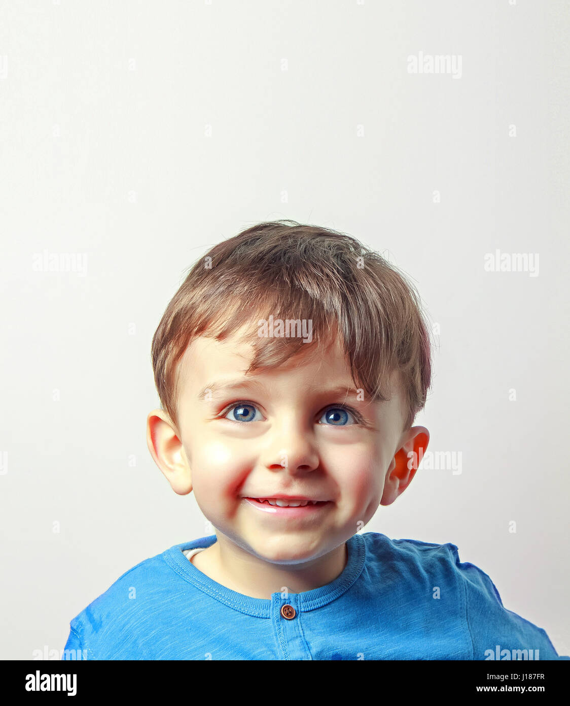 Happy child smiling at the camera Stock Photo - Alamy