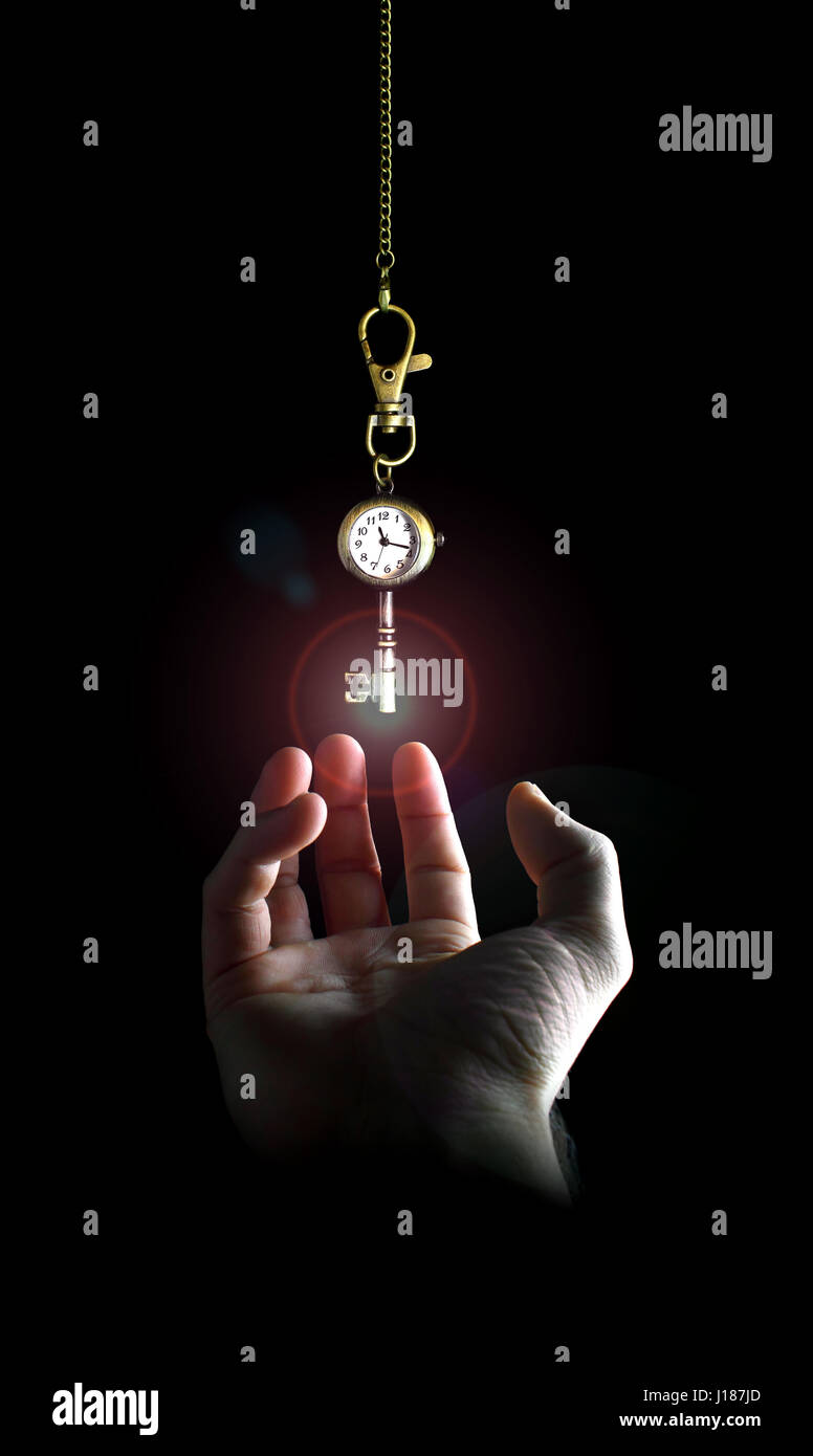 Reaching the key of time Stock Photo - Alamy