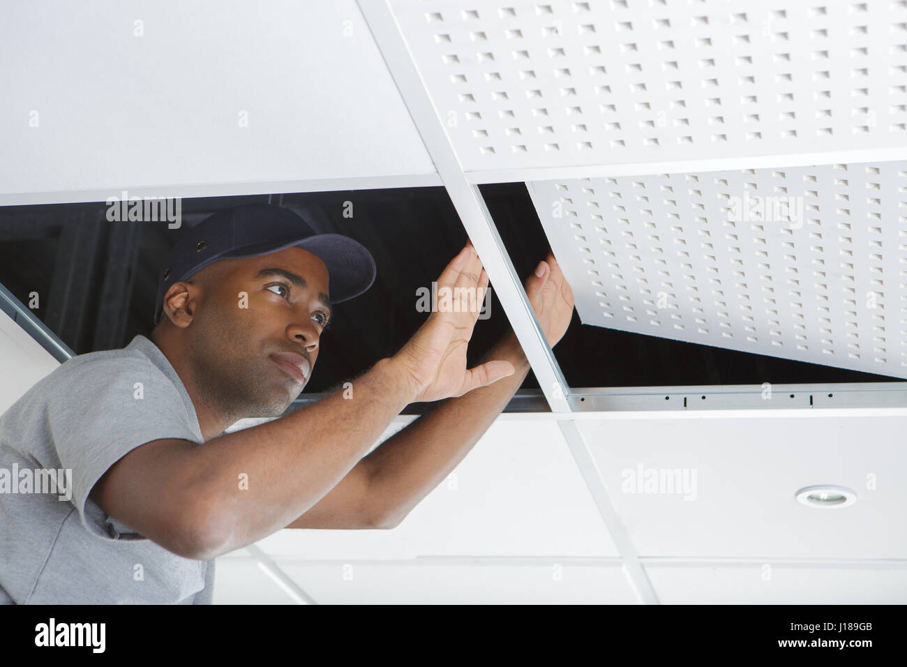 installing the ceiling Stock Photo - Alamy