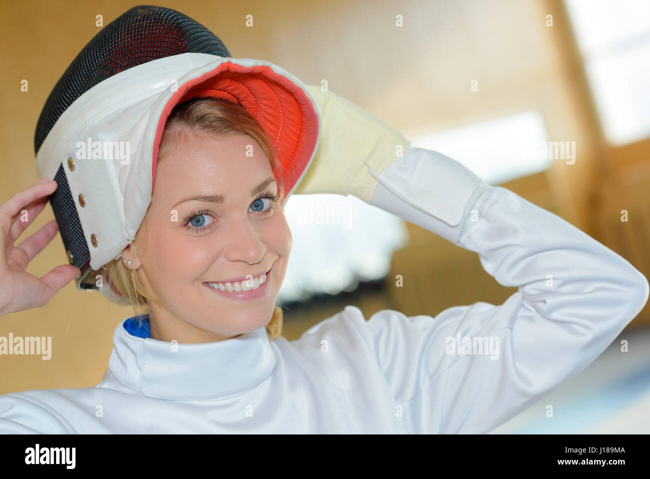 putting the fencing helmet Stock Photo - Alamy