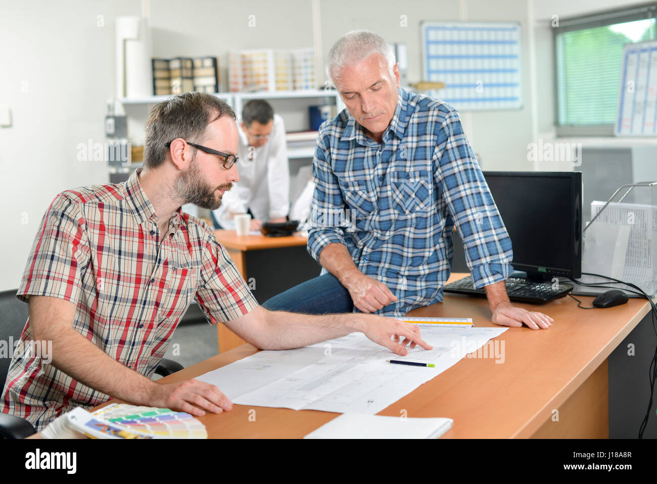 Architect and a client Stock Photo - Alamy