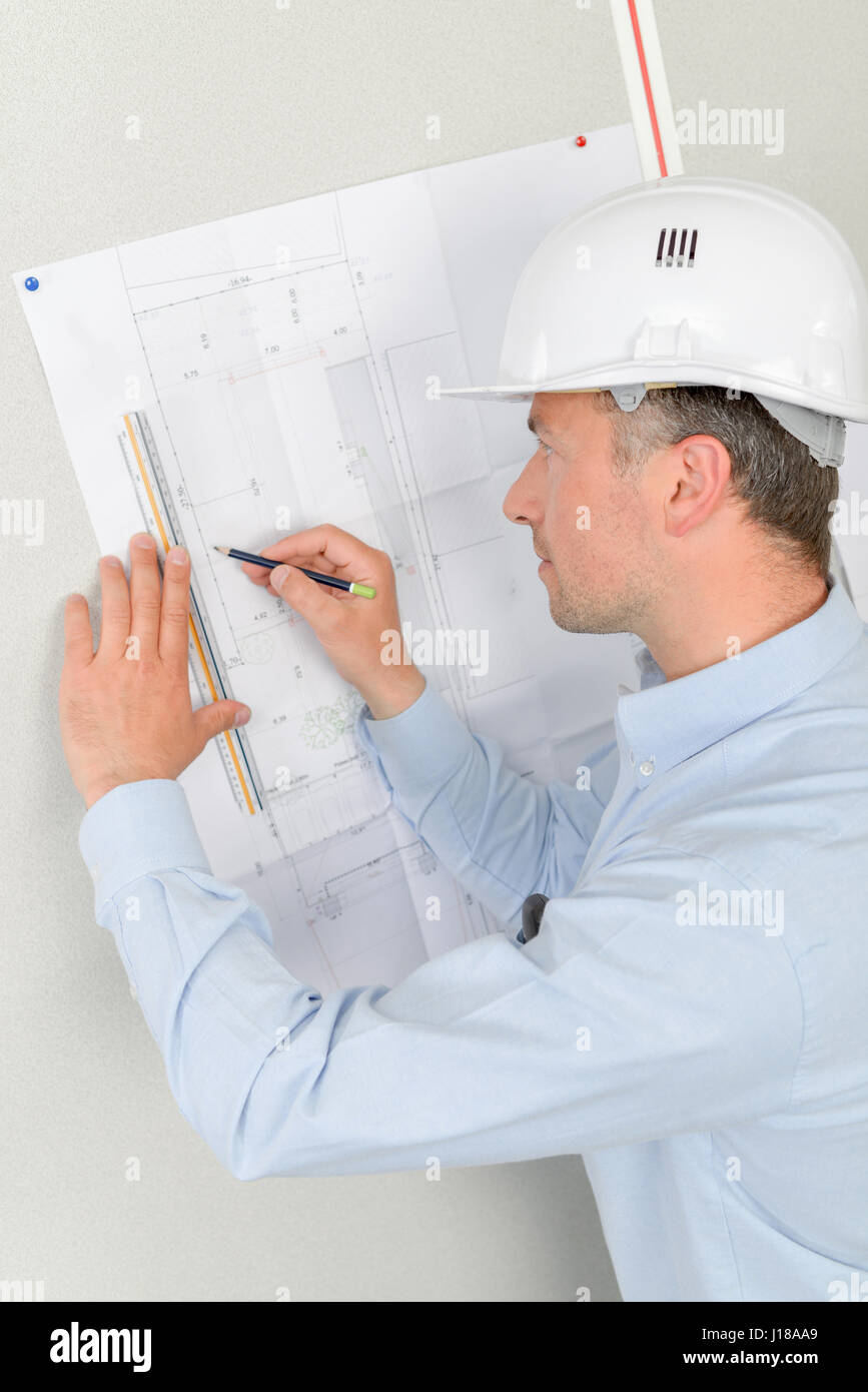 Architect writing on blueprints Stock Photo - Alamy