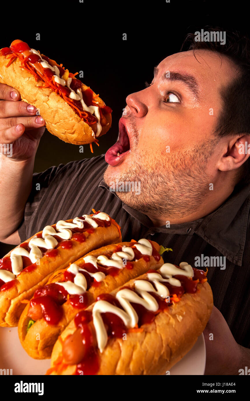 Fat Man Eating Chili Dogs