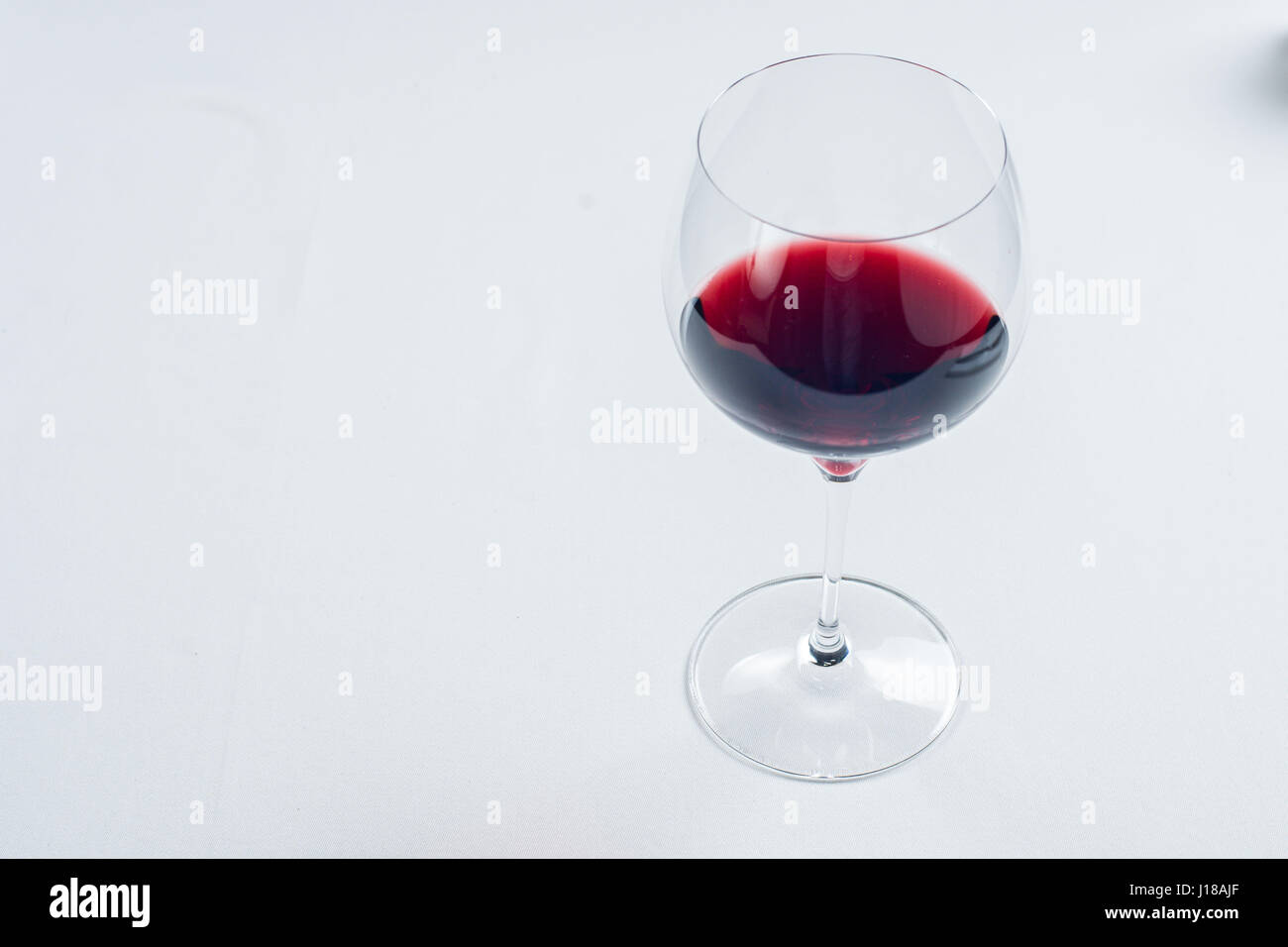 Red wine in a glass isolated Stock Photo - Alamy