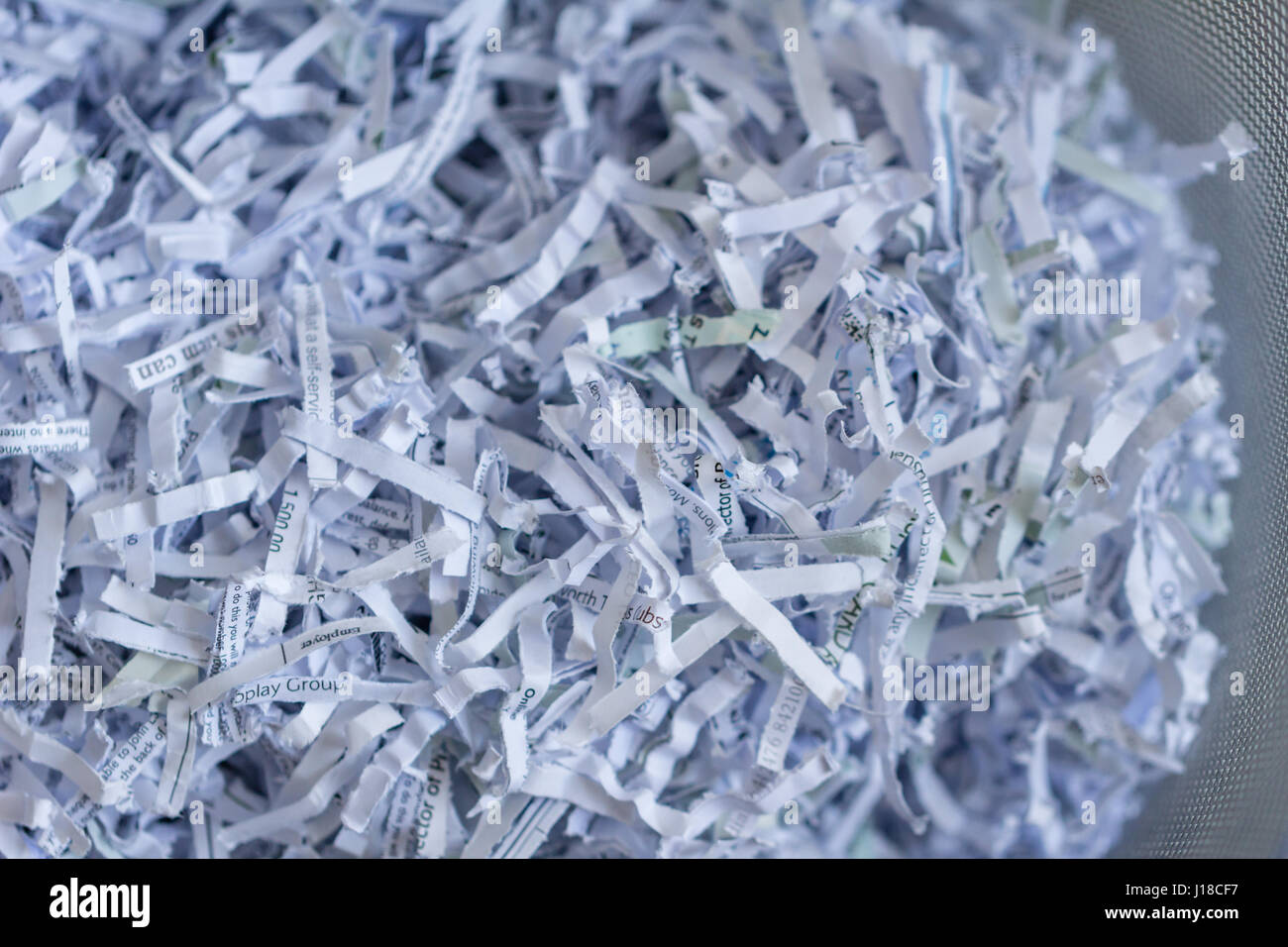Shredded office paper in a basket Stock Photo - Alamy