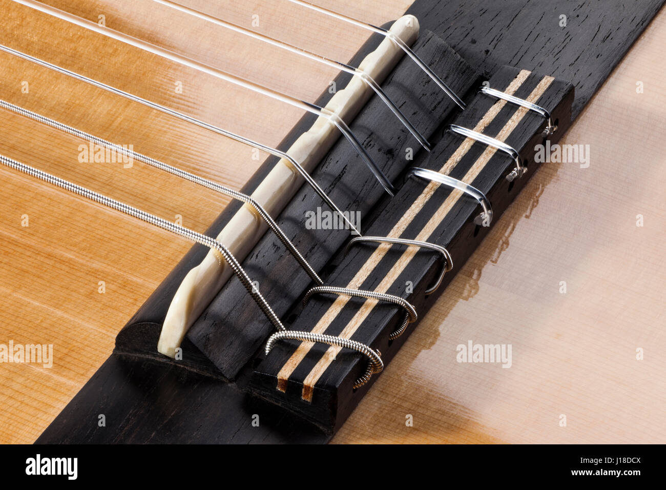 Details of a classic wooden guitar with strings Stock Photo - Alamy