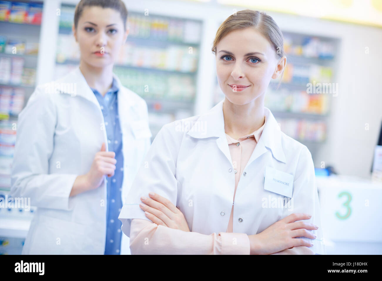 Two female pharmacists at drug store Stock Photo - Alamy