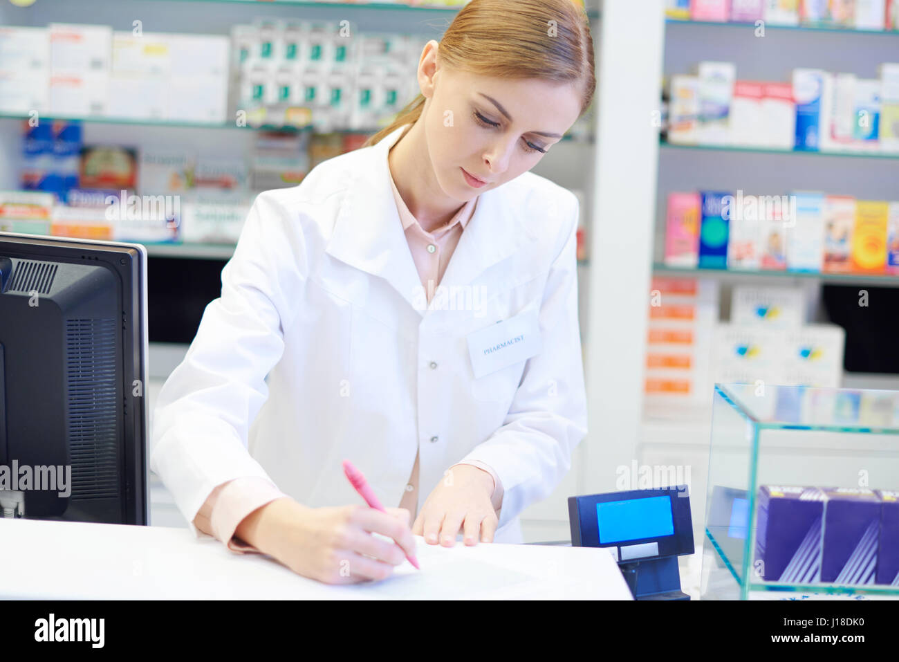 Female pharmacist doing daily duties Stock Photo - Alamy
