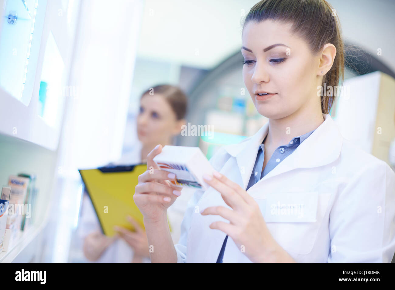 Pharmacist doing checklist at drug store Stock Photo - Alamy