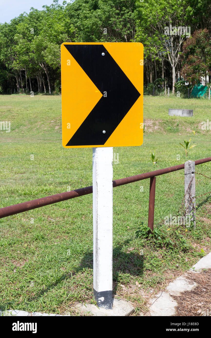 Direction arrow road sign in rural setting Stock Photo - Alamy
