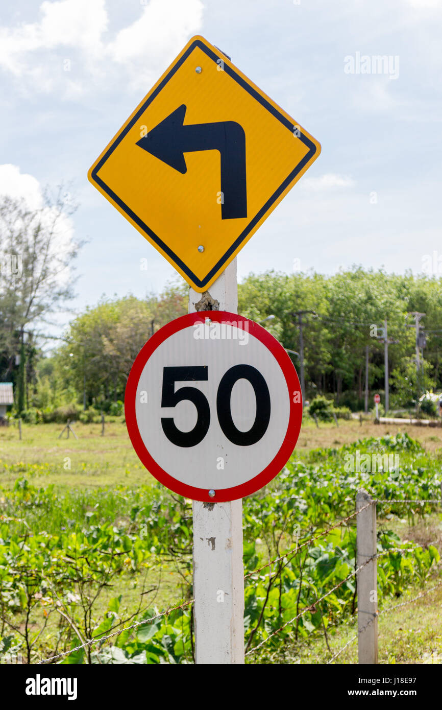 Direction arrow and 50 speed limit sign in rural setting Stock Photo ...