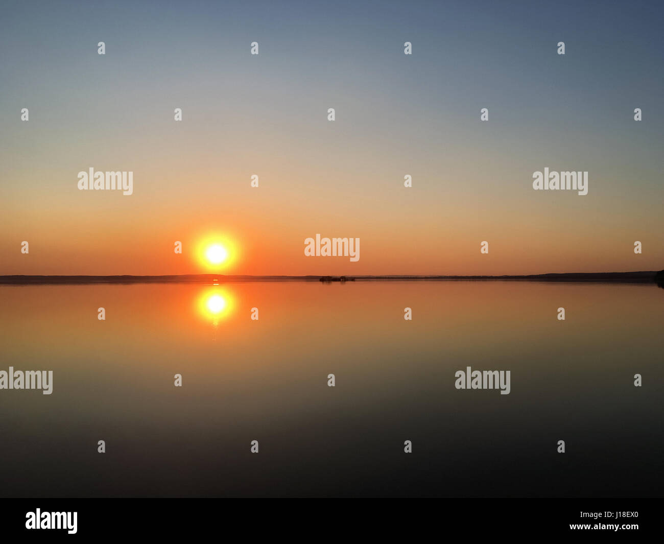 Skyline and sky reflection on the surface of the water hi-res stock ...