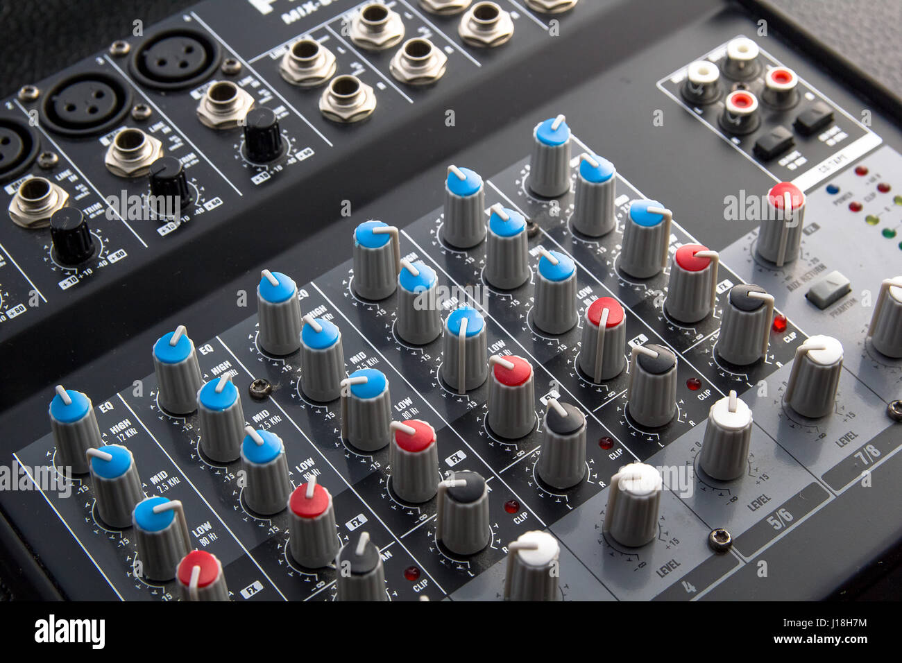 Mixer table with several knobs Stock Photo - Alamy