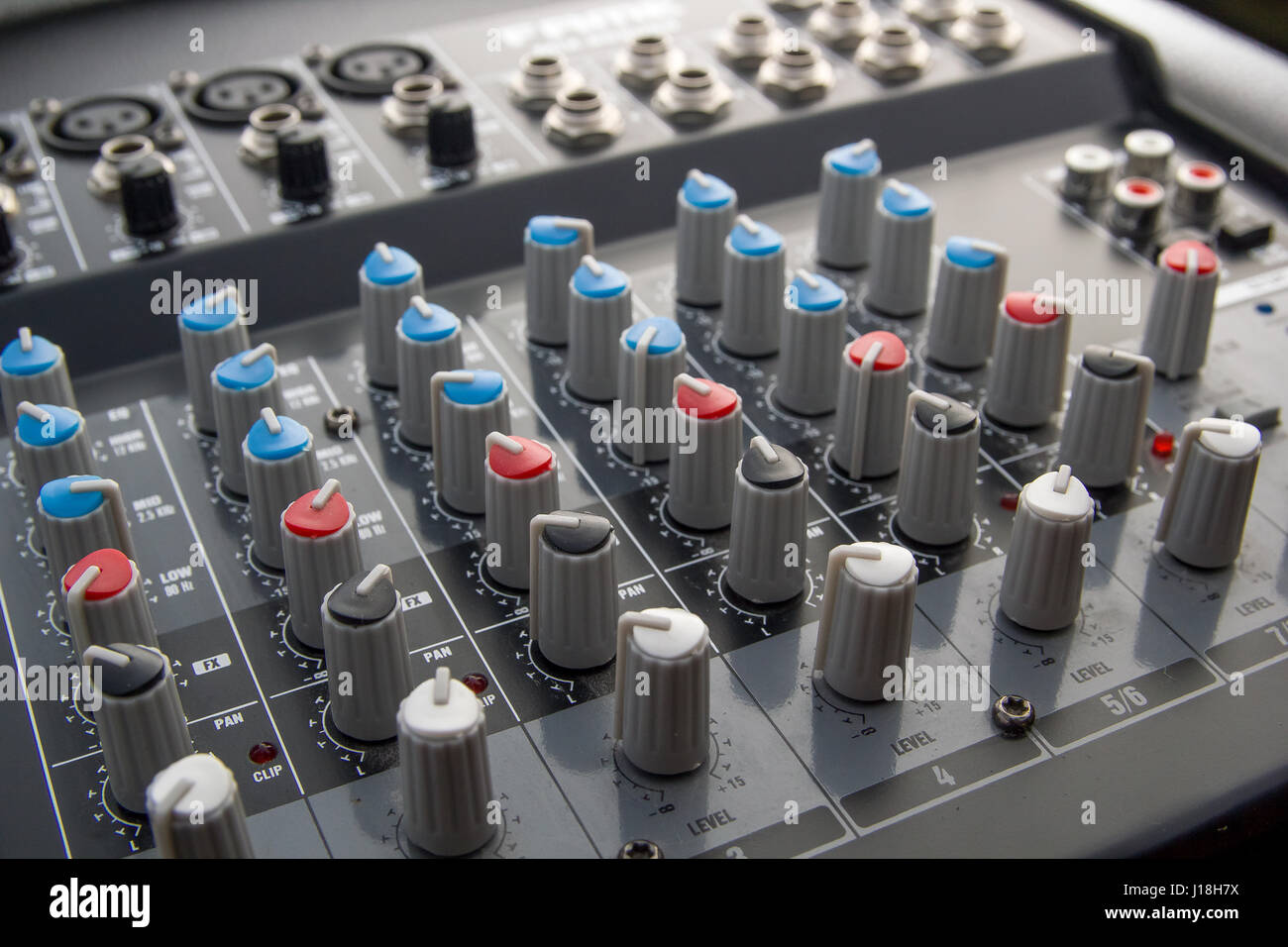 Mixer table with several knobs Stock Photo - Alamy