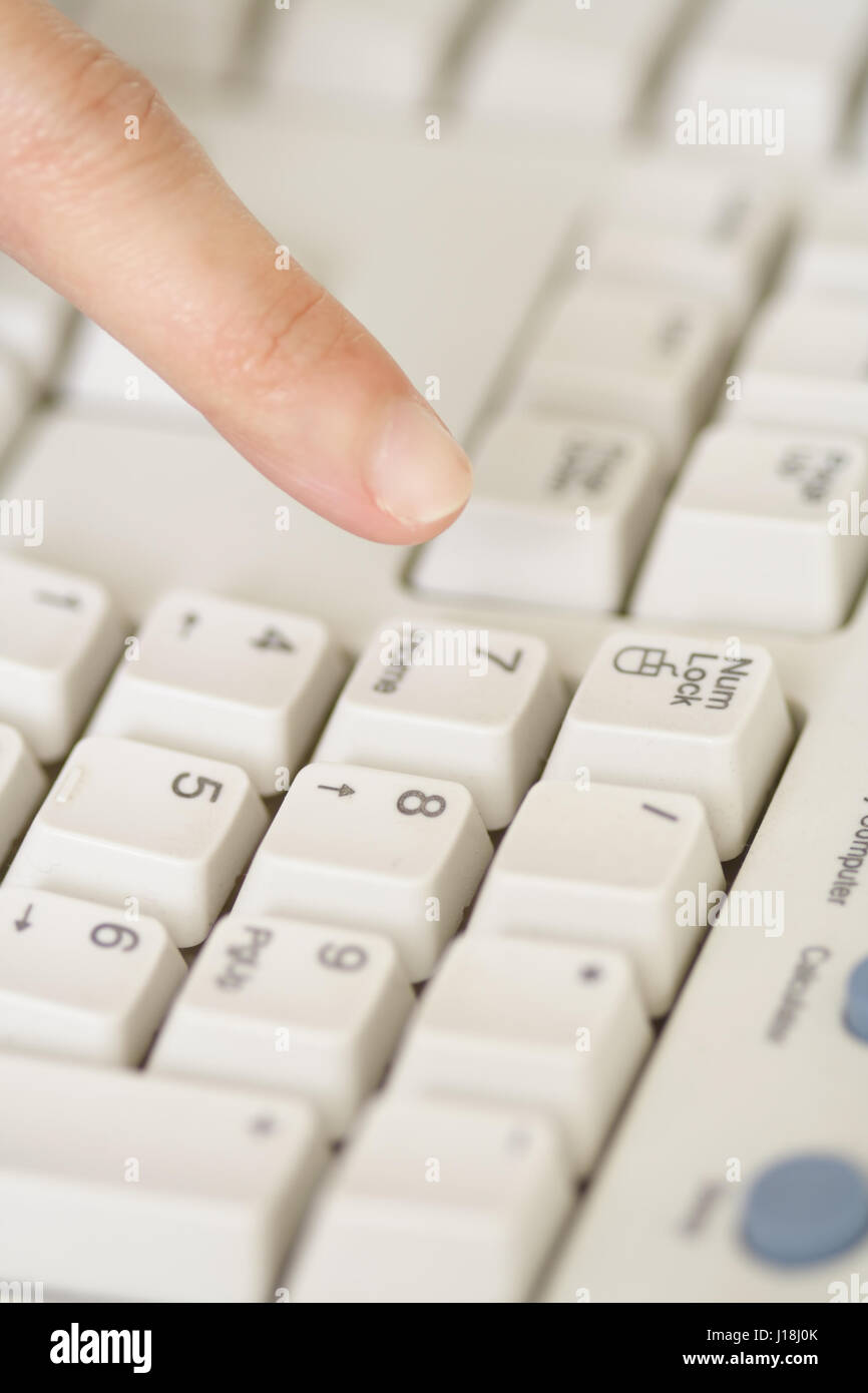 Finger on keyboard typing Stock Photo - Alamy