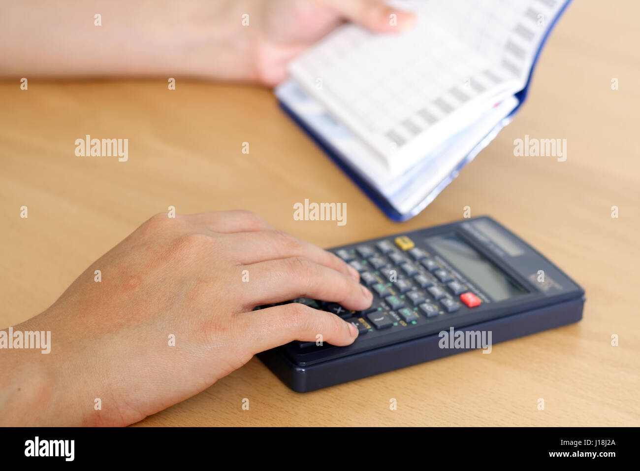 Balancing the checkbook Stock Photo - Alamy