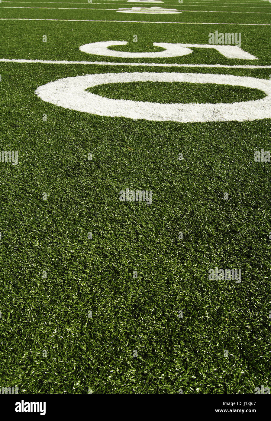 Fifty yard line of an american football field Stock Photo - Alamy