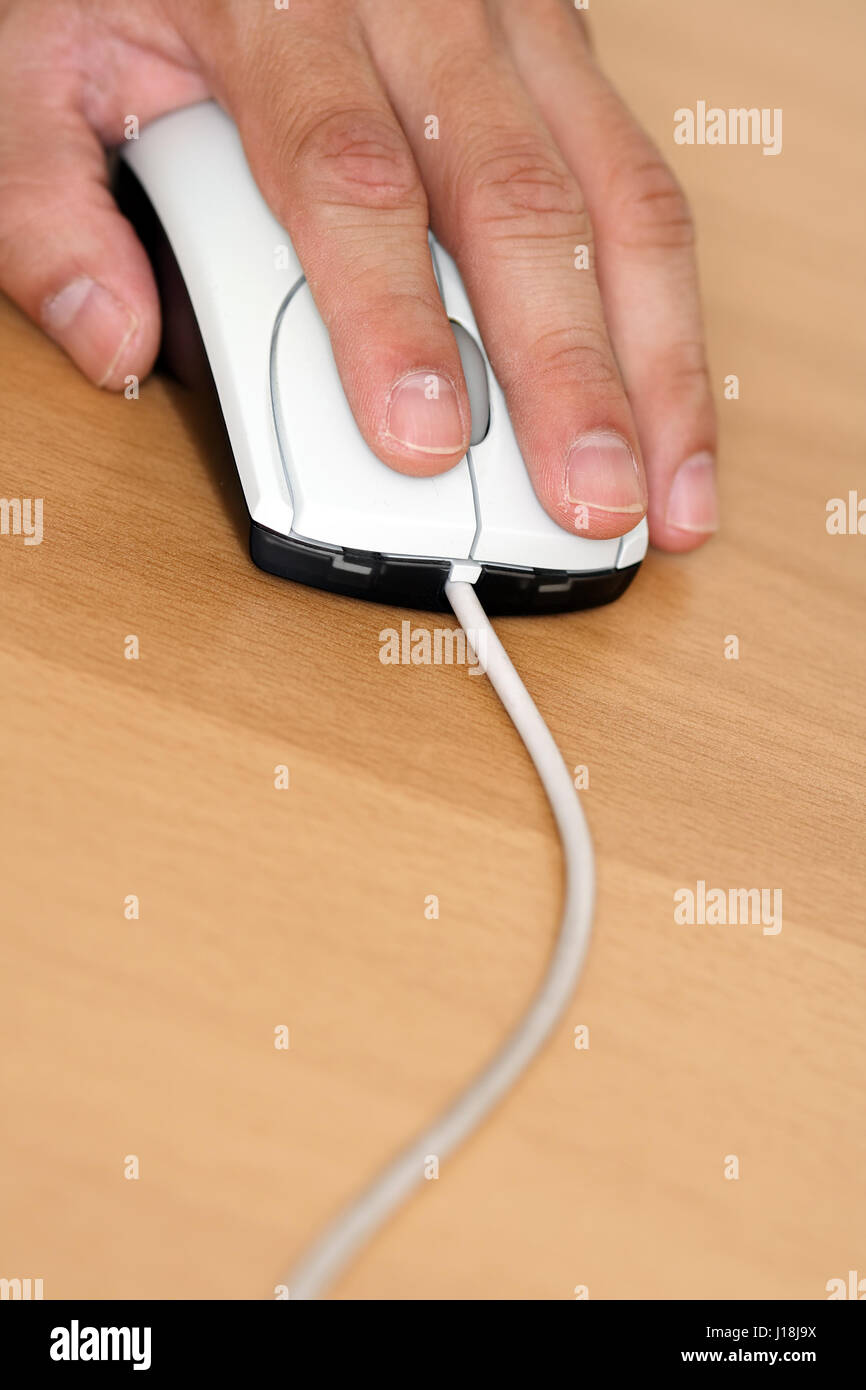 Businessman using a mouse Stock Photo - Alamy