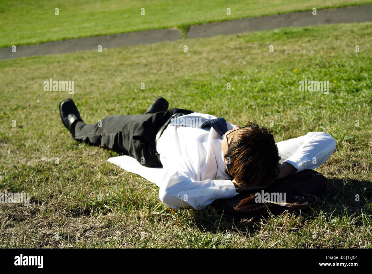 Businessman sunbathing hi-res stock photography and images - Alamy