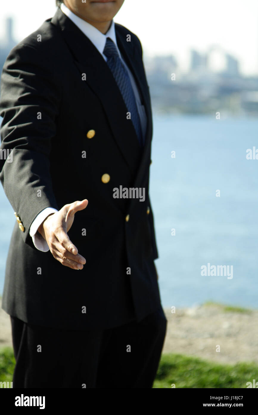Businessman ready to shake hands Stock Photo - Alamy