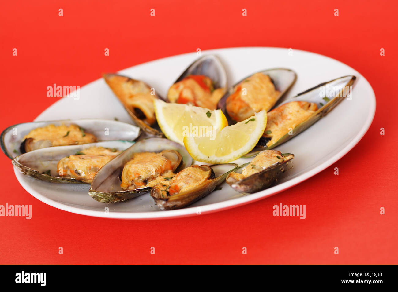 Baked mussels with mayonnaise Stock Photo - Alamy