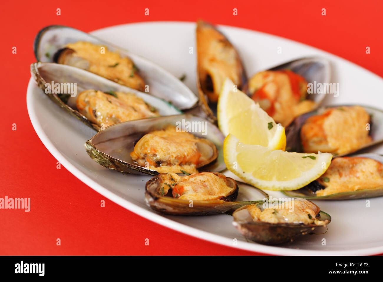 Baked mussels with mayonnaise Stock Photo - Alamy
