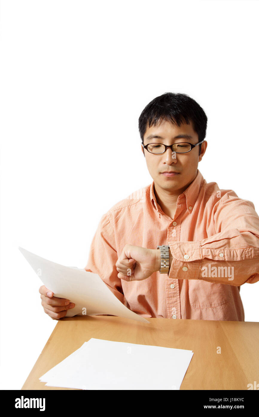 Businessman checking on his watch Stock Photo - Alamy