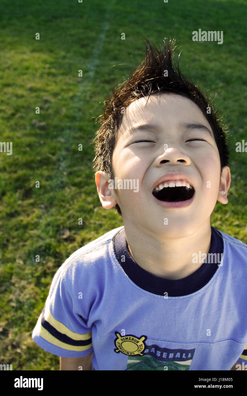 A happy kid playing outdoor Stock Photo - Alamy