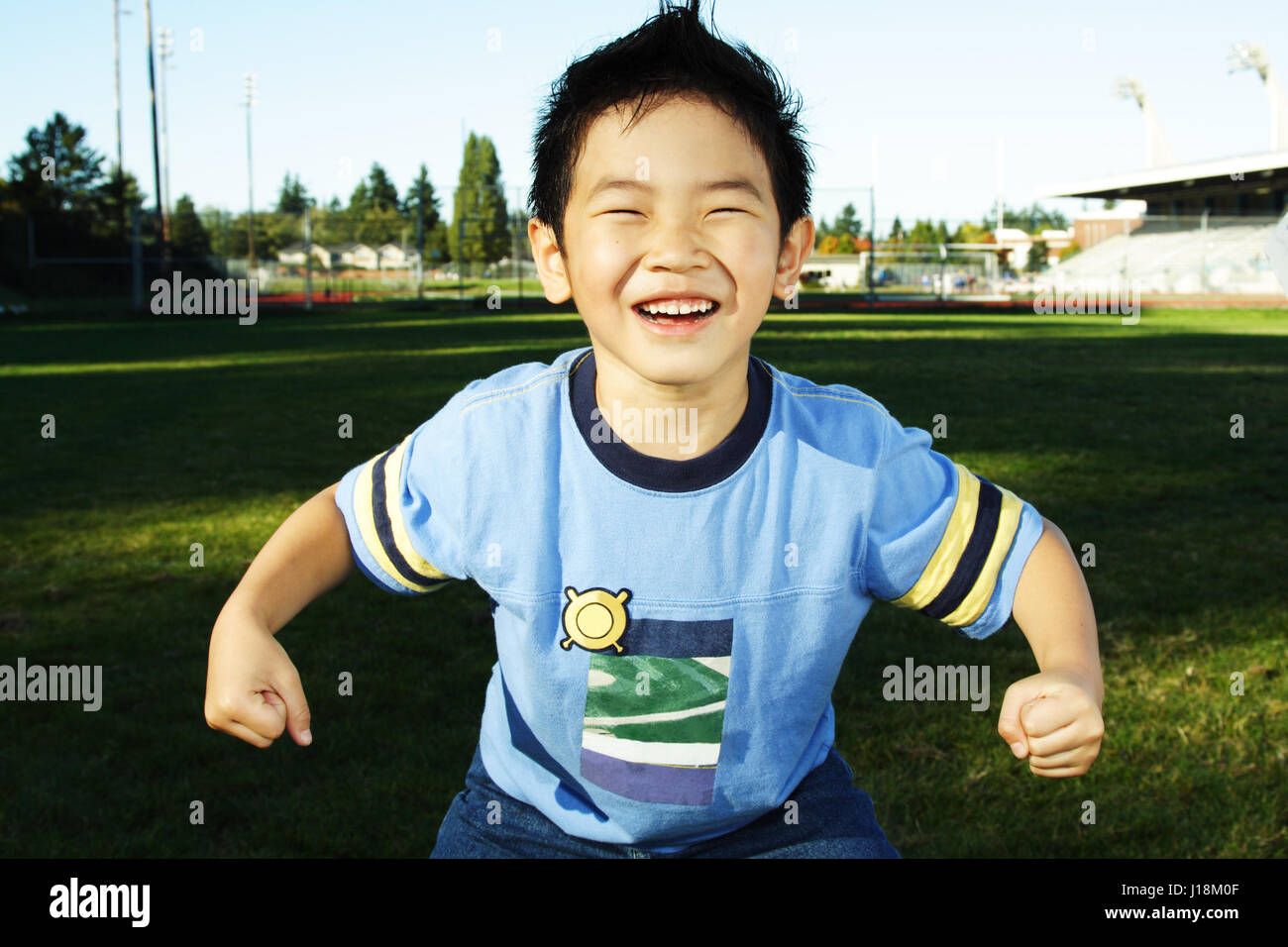 A happy boy showing a happy expression Stock Photo - Alamy