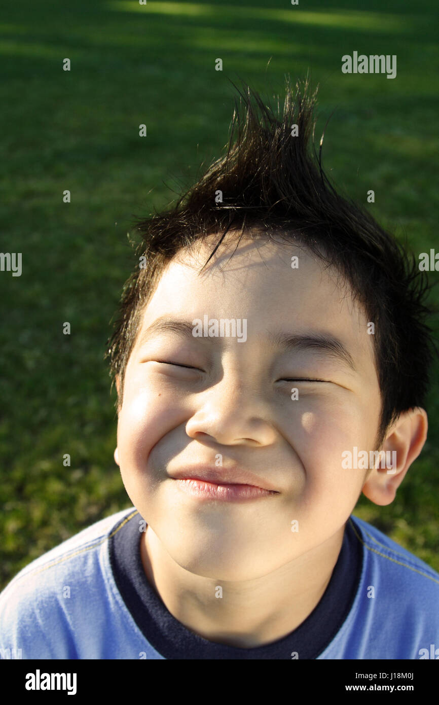 A happy kid daydreaming outdoor Stock Photo - Alamy