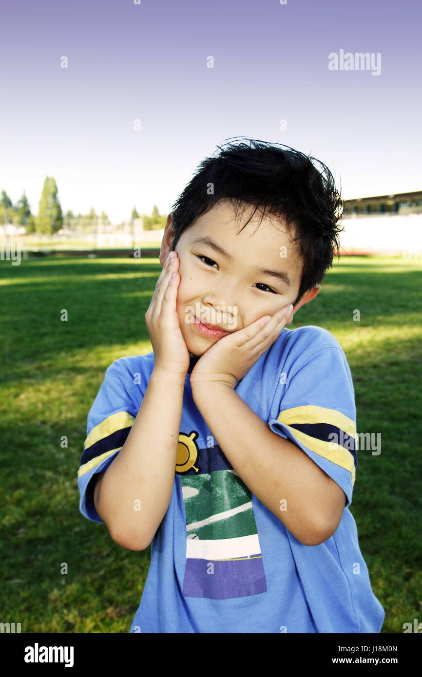 A cute boy posing outdoor Stock Photo - Alamy