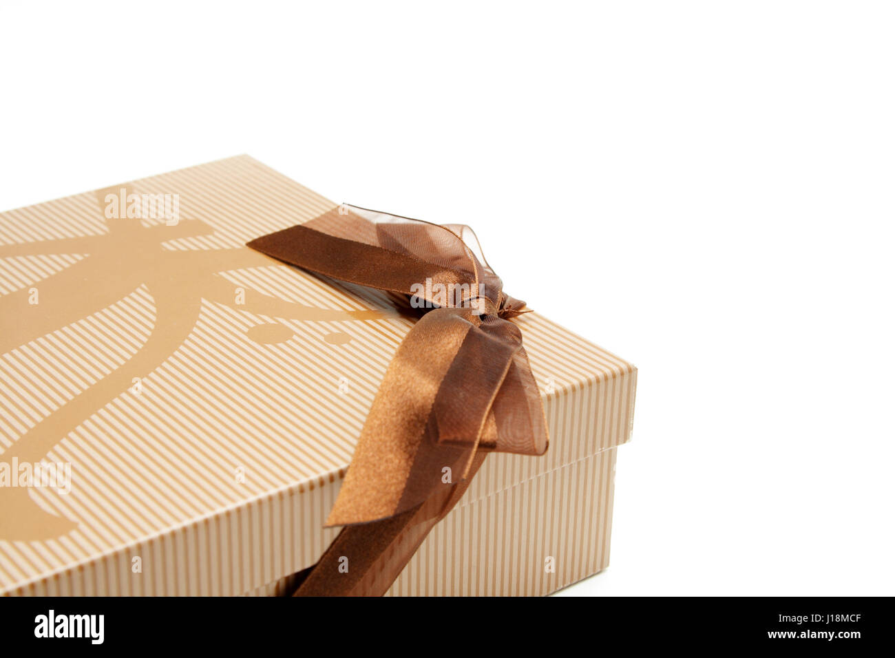 A chocolate gift box wrapped neatly with ribbon Stock Photo - Alamy
