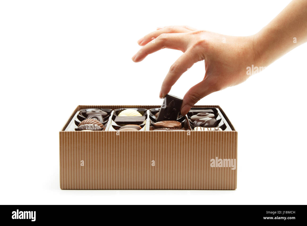 Choosing a chocolate from a box hi-res stock photography and images - Alamy