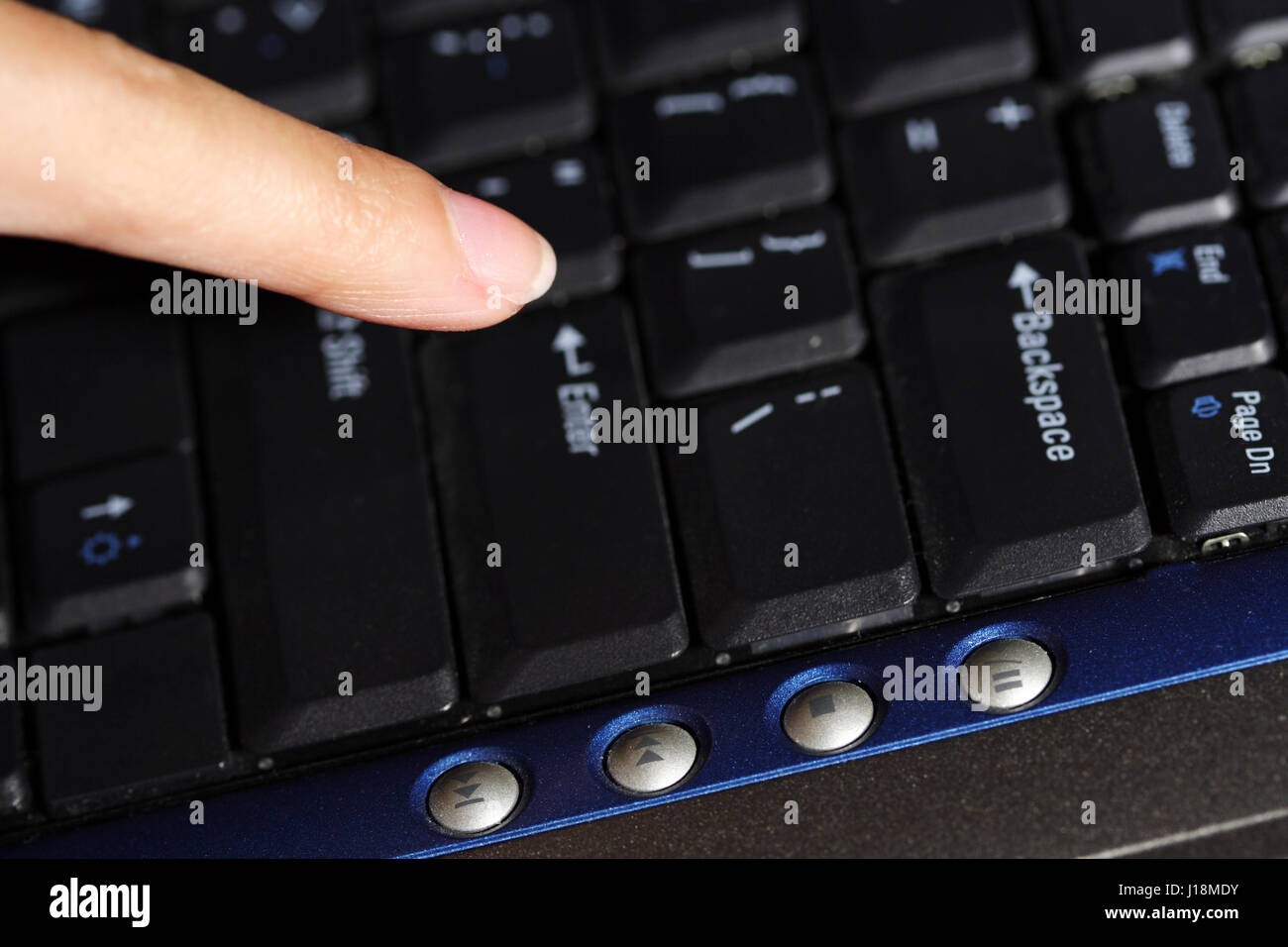 A businesswoman with her finger pointing at the enter key Stock Photo ...