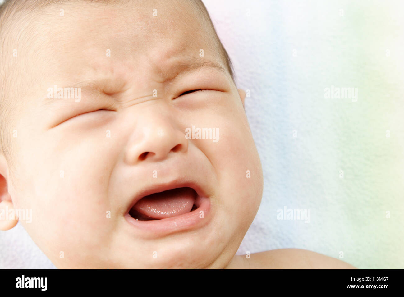 A closeup portrait of a crying baby Stock Photo - Alamy