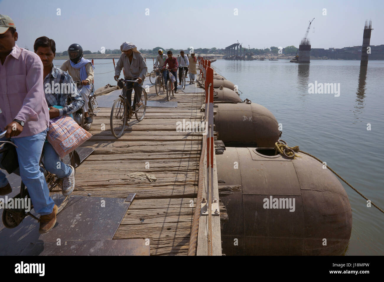 Bicycles on pontoon floating bridge, varanasi, uttar pradesh, india ...