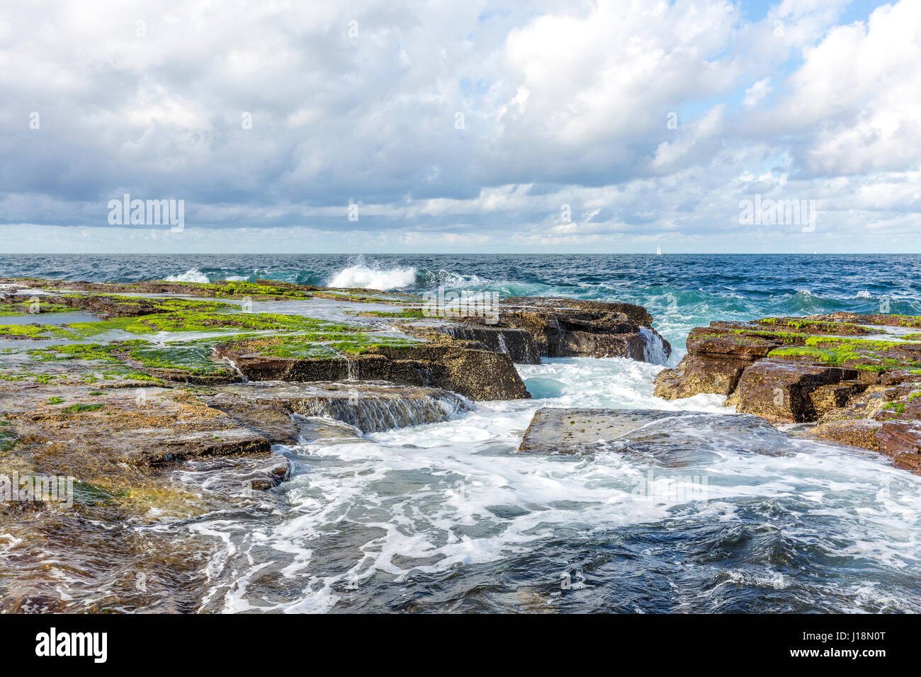 Ocean and rock shelf at North Narrabeen beach on Sydney northern ...