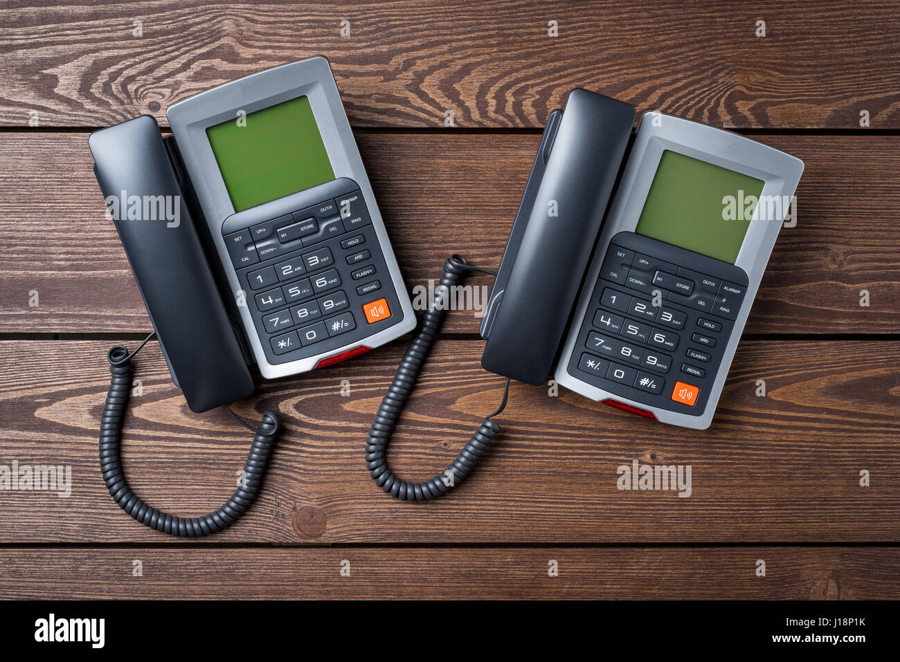 Telephone on wooden table Stock Photo - Alamy