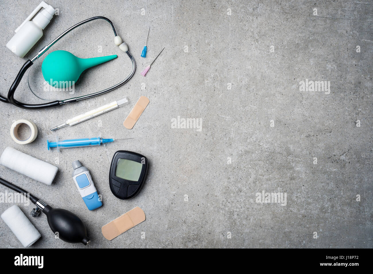 Medical equipment on gray stone background Stock Photo - Alamy