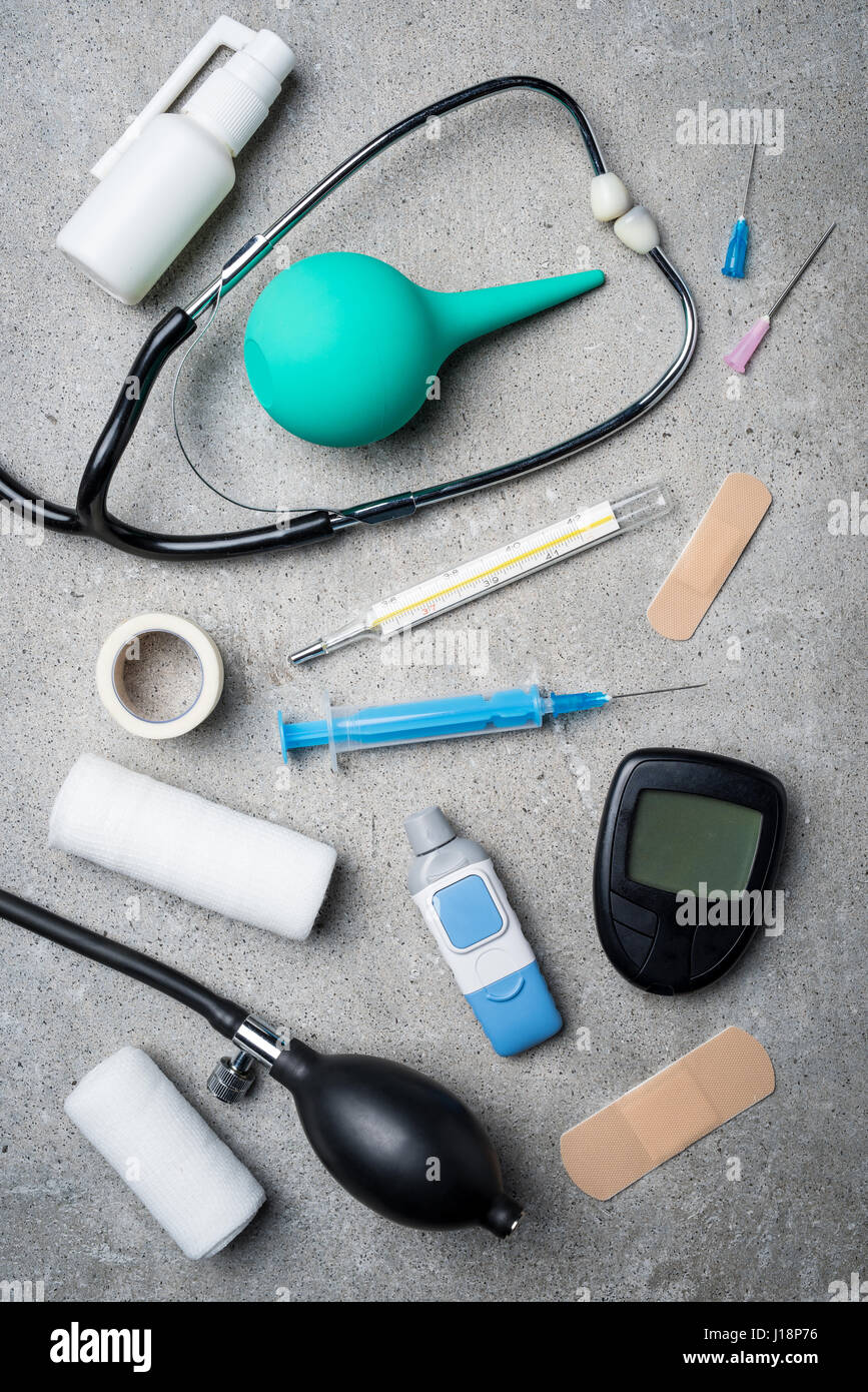Medical equipment on gray stone background Stock Photo - Alamy